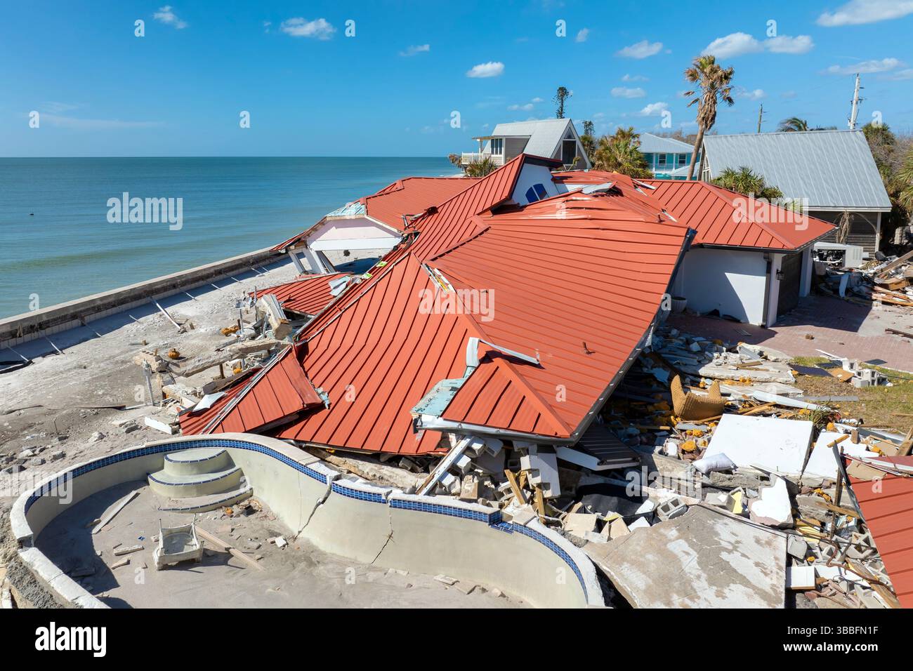 Natural disaster and its consequences. Hurricane destroyed houses roof ...