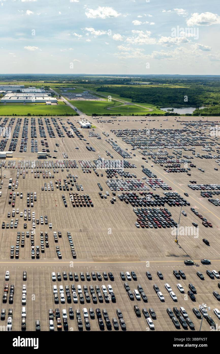 Parked new cars at the automotive plant factory parking lot ready for ...
