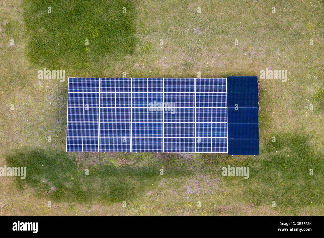 Solar photovoltaic panels mounted on stand-alone frame on backyard ...