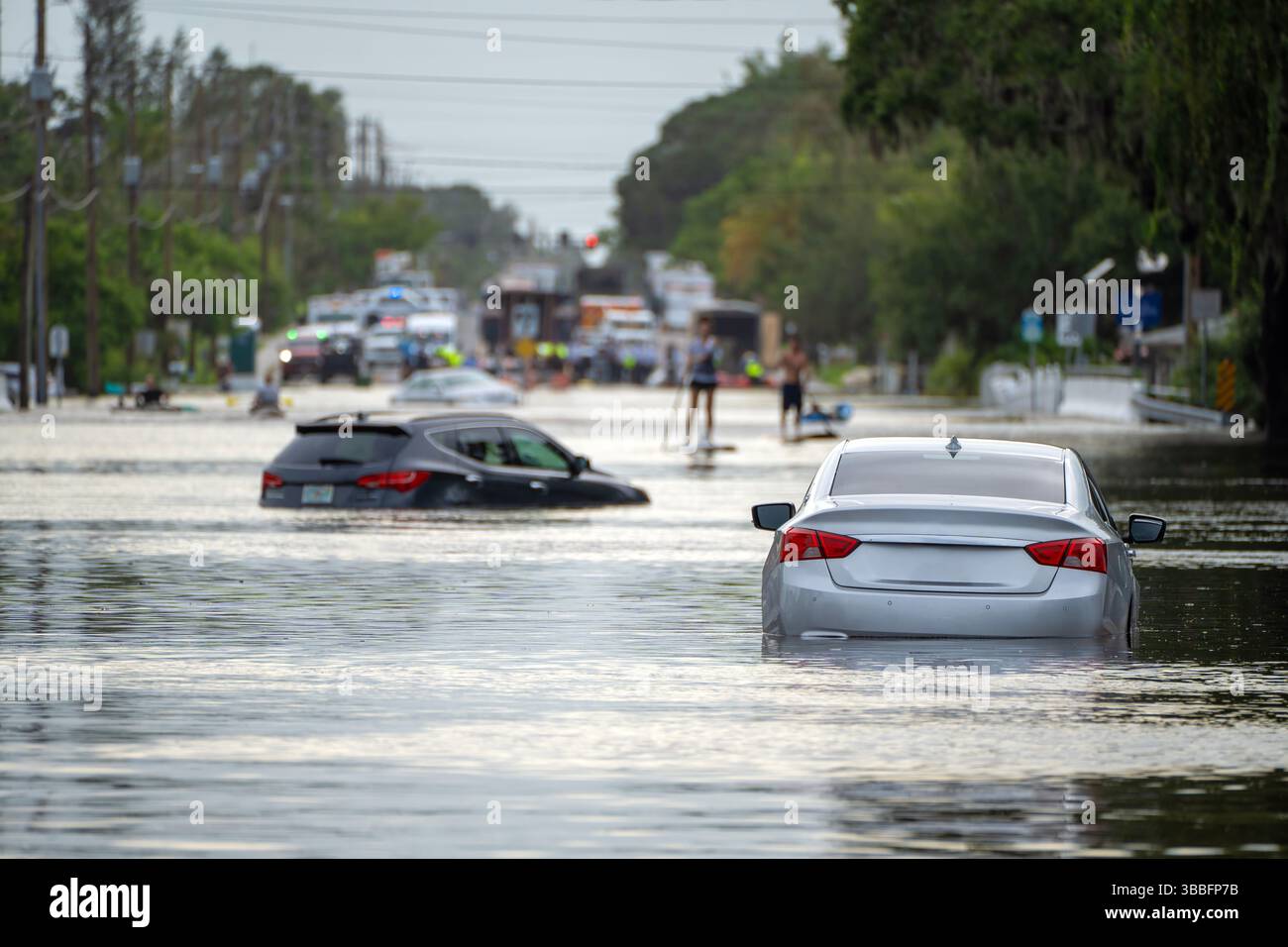 Stuck cars on flooded city street after hurricane rainfall in Sarasota ...