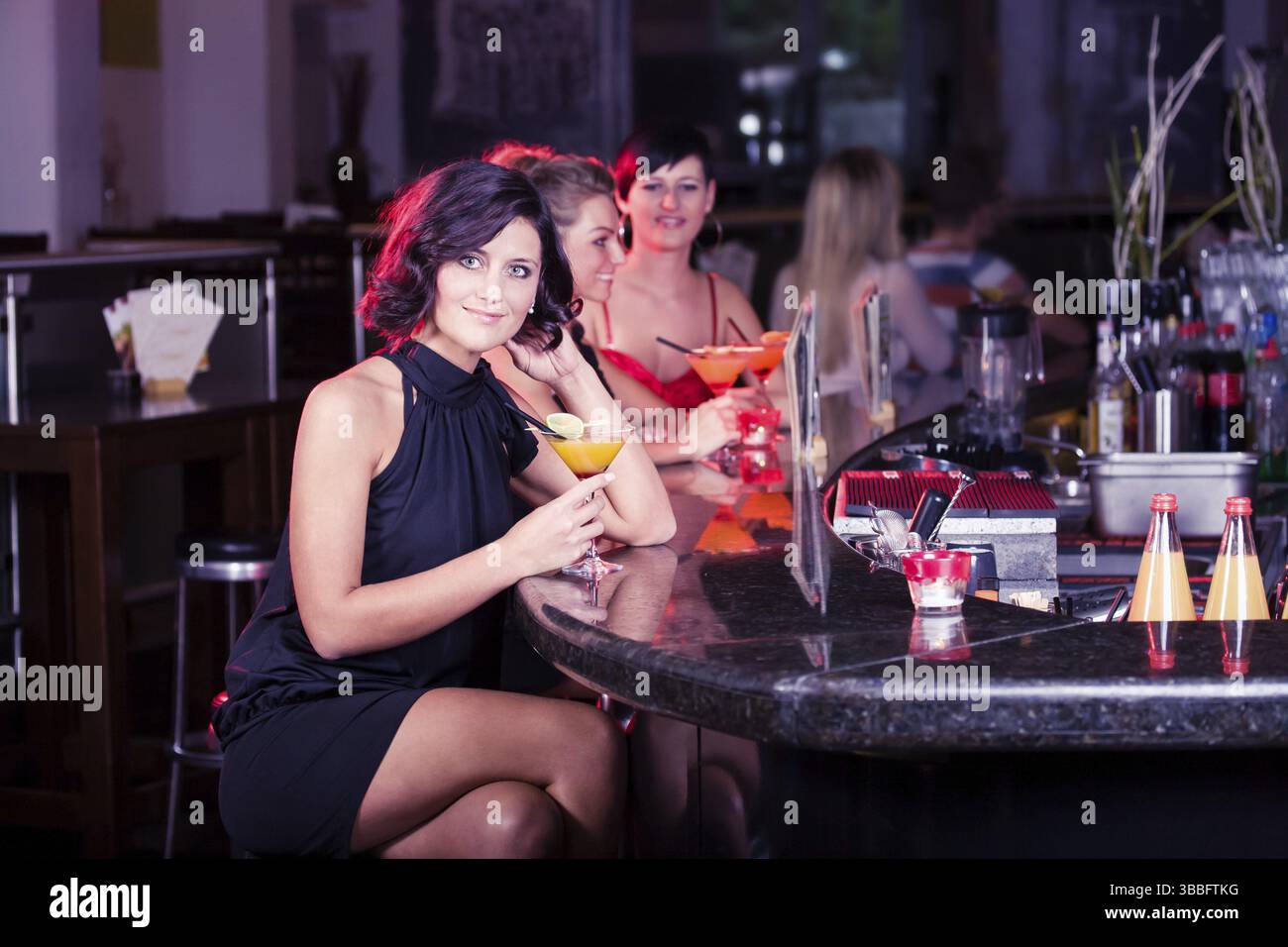 Group of young women in the bar Stock Photo - Alamy