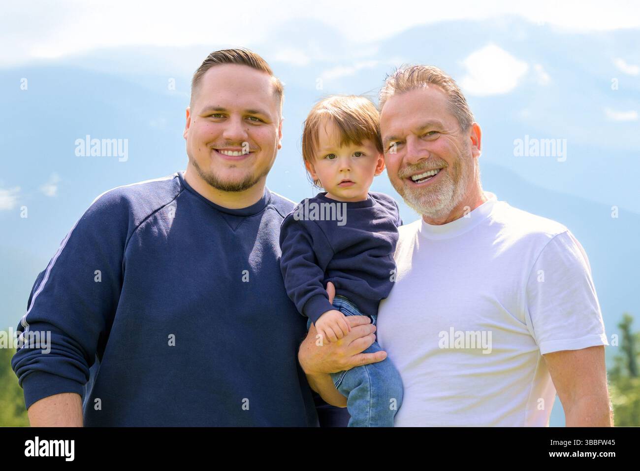 A multigenerational family portrait of grandfather, father, and child ...