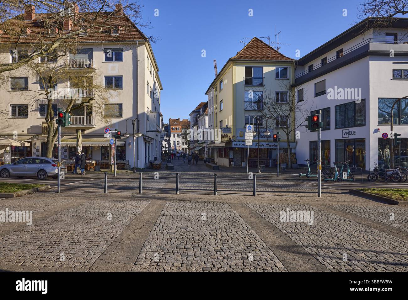 Pedestrian crossing with traffic lights, bollards, general architecture ...