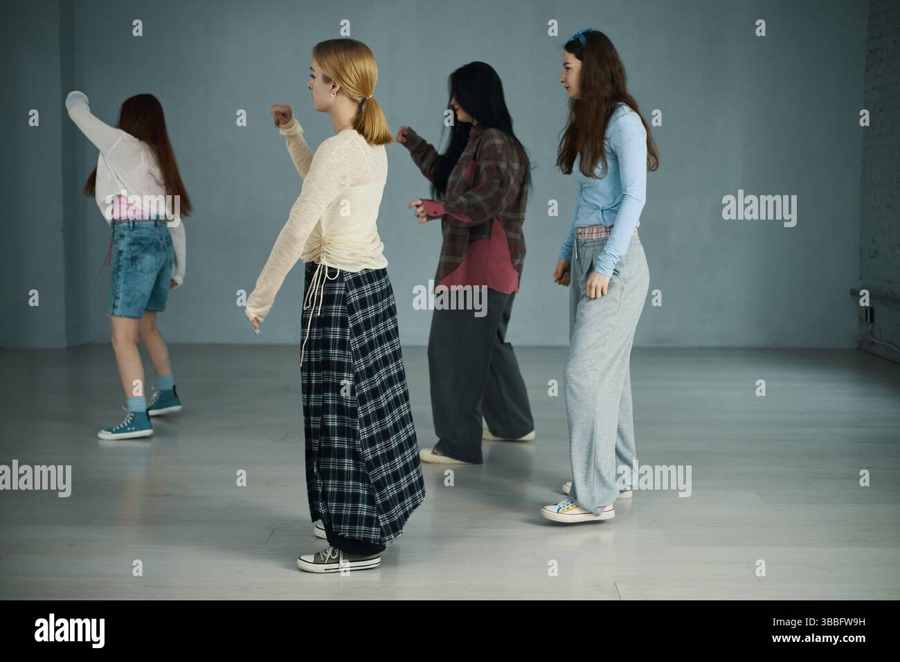 Teenagers Practicing Dance Moves in Modern Dance Studio Stock Photo - Alamy