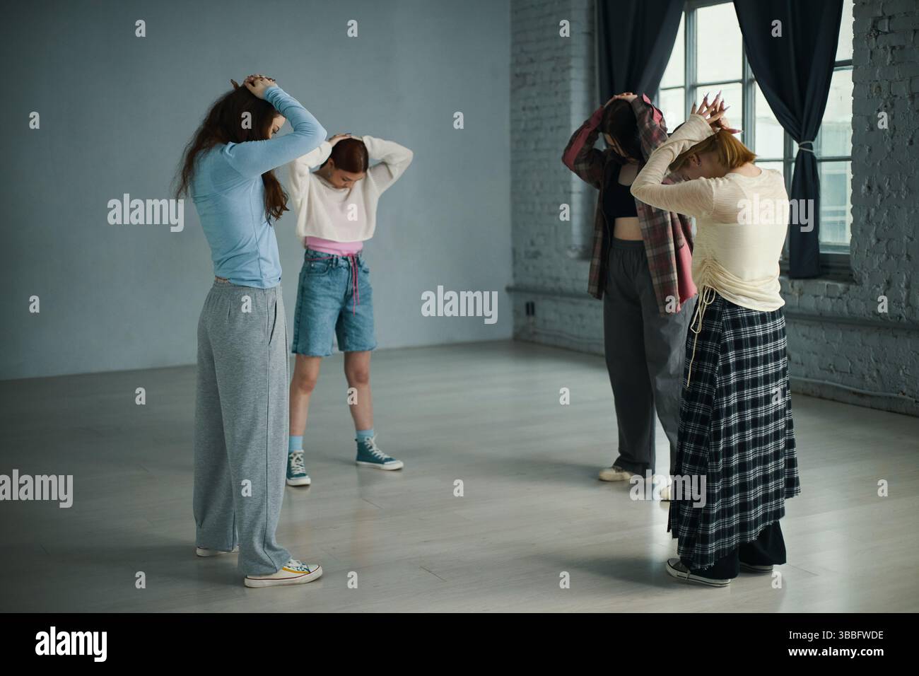 Practicing Dance Movements in Spacious Studio Stock Photo - Alamy