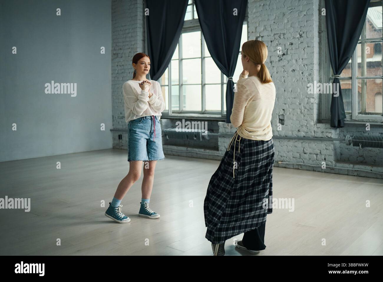 Two Women Practicing Dance in Spacious Studio Stock Photo - Alamy
