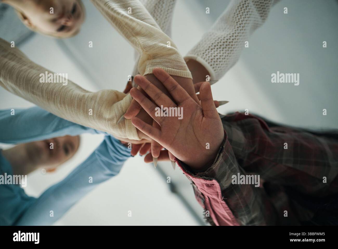 Joining Hands in Unity and Collaboration for Teamwork Stock Photo - Alamy