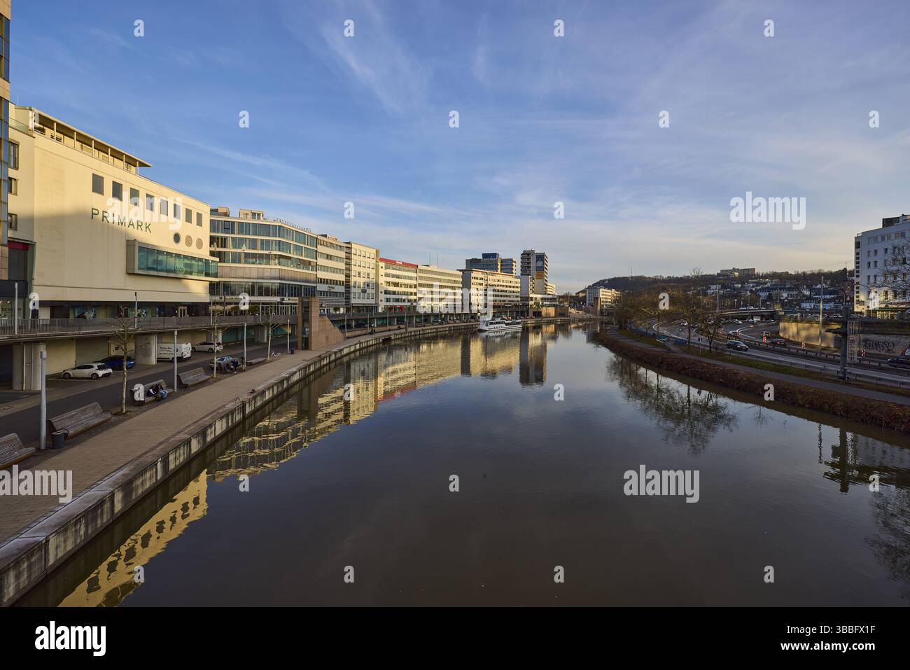 River Saar, modern architecture, trees, reflections on the water ...
