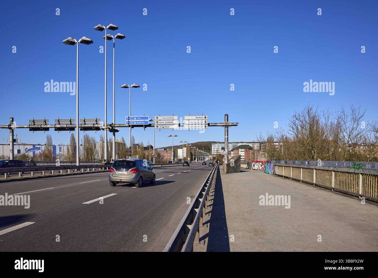 Traffic areas, road, footpath, crash barrier, metal railings, lanterns ...