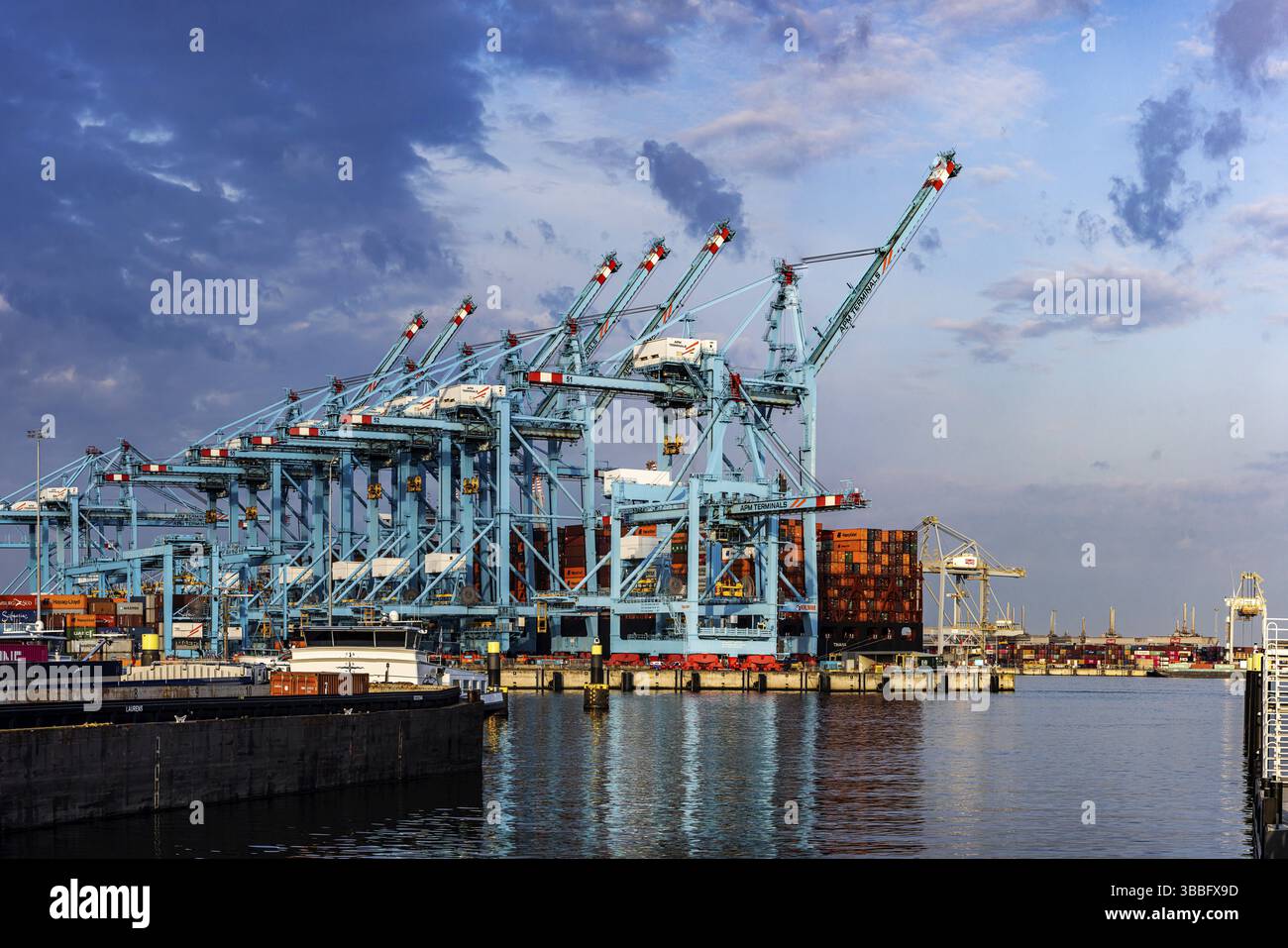 Container terminal in the seaport of Rotterdam with container ship ...
