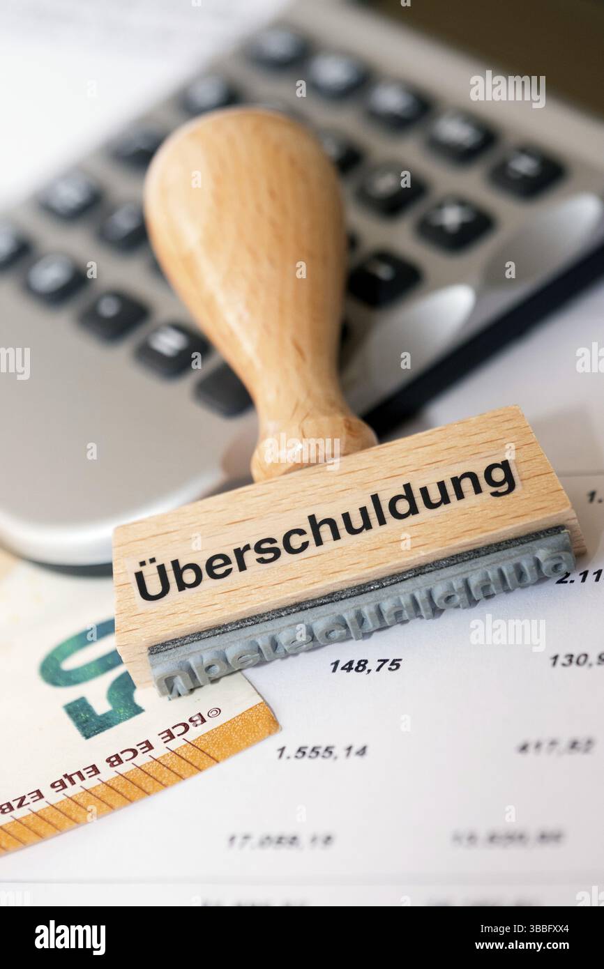 A stamp labelled Overindebtedness Stock Photo - Alamy