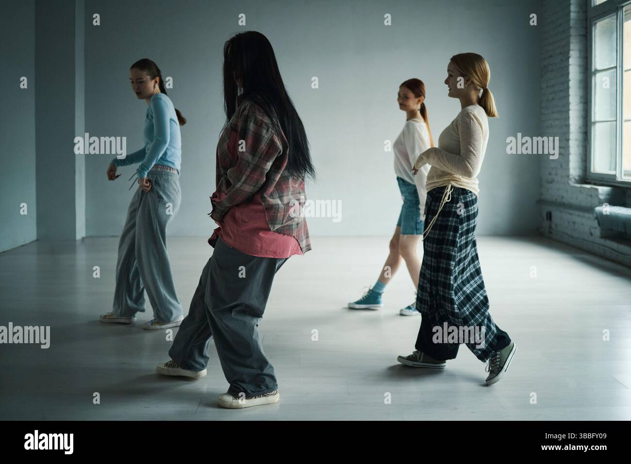 Four Young Women Dancing in Contemporary Fashion Stock Photo - Alamy