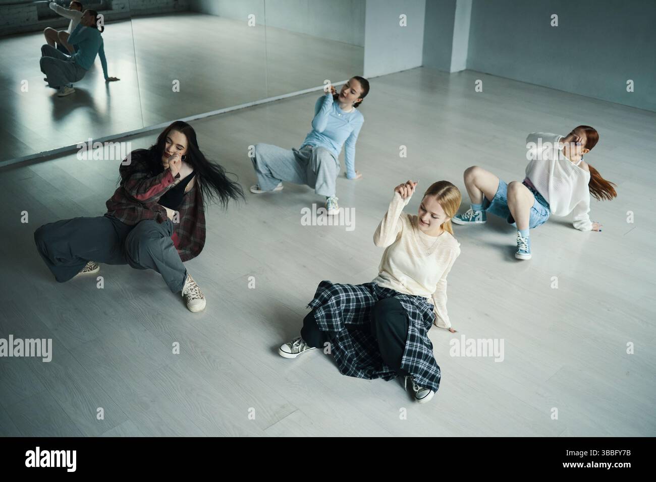 Group of Dancers Practicing Hip-Hop Routine in Studio Stock Photo - Alamy