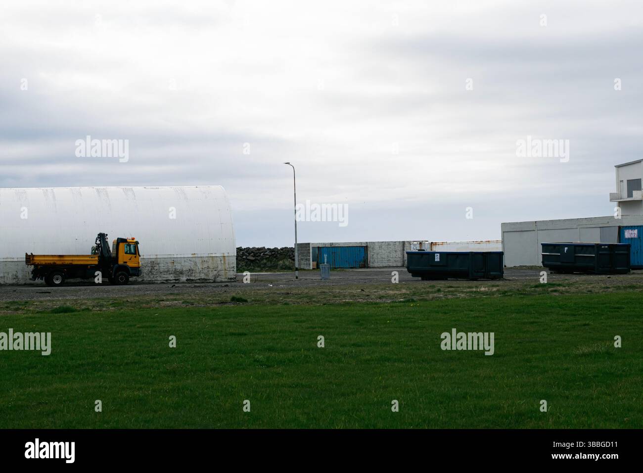 Akranes, Iceland - May 15, 2025: A rural industrial scene with a yellow ...