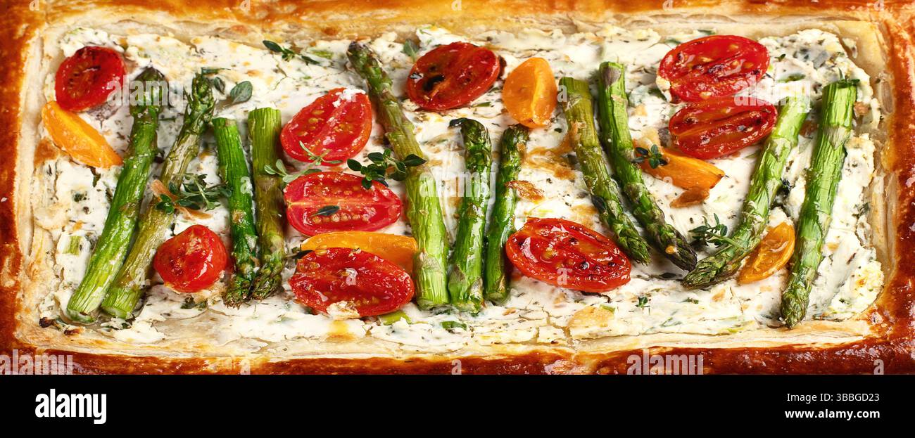 Healthy Puff pastry tart with asparagus and tomatoes. Panorama Stock ...
