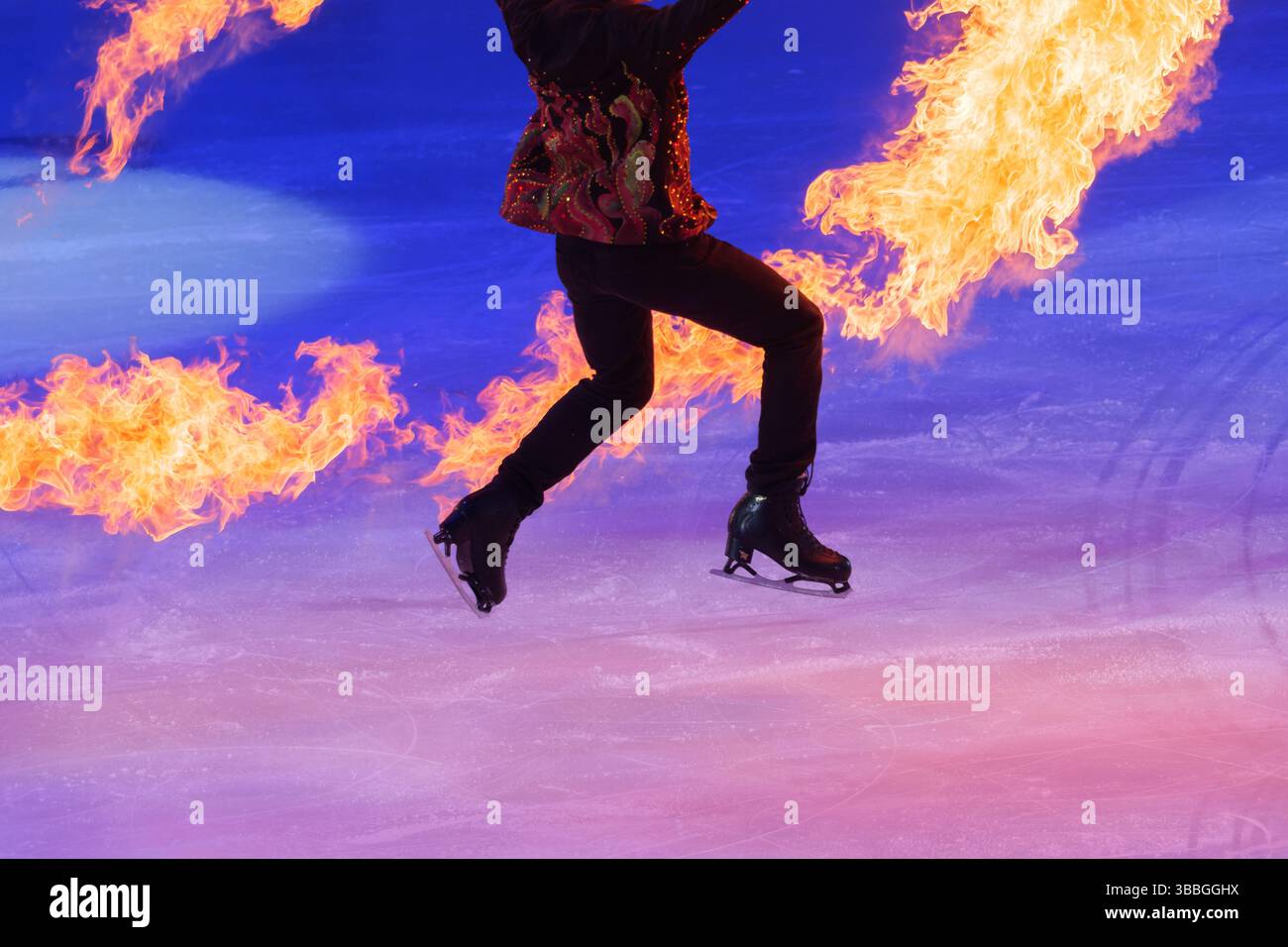 Skater Performing an Artistic Performance on the Ice Rink with Flaming ...