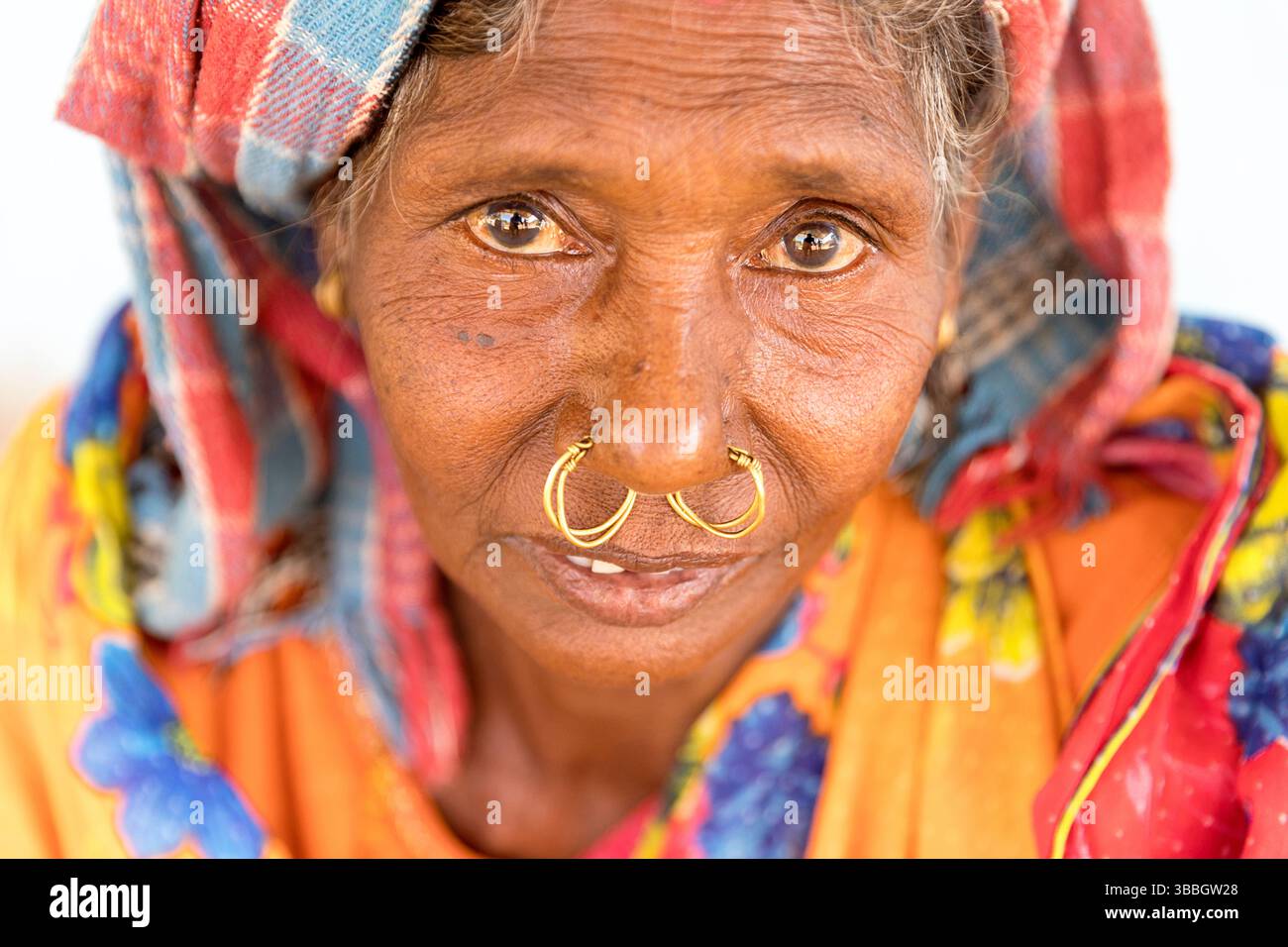 Woman in colourful traditional clothes, smiling, posing for a photo in ...