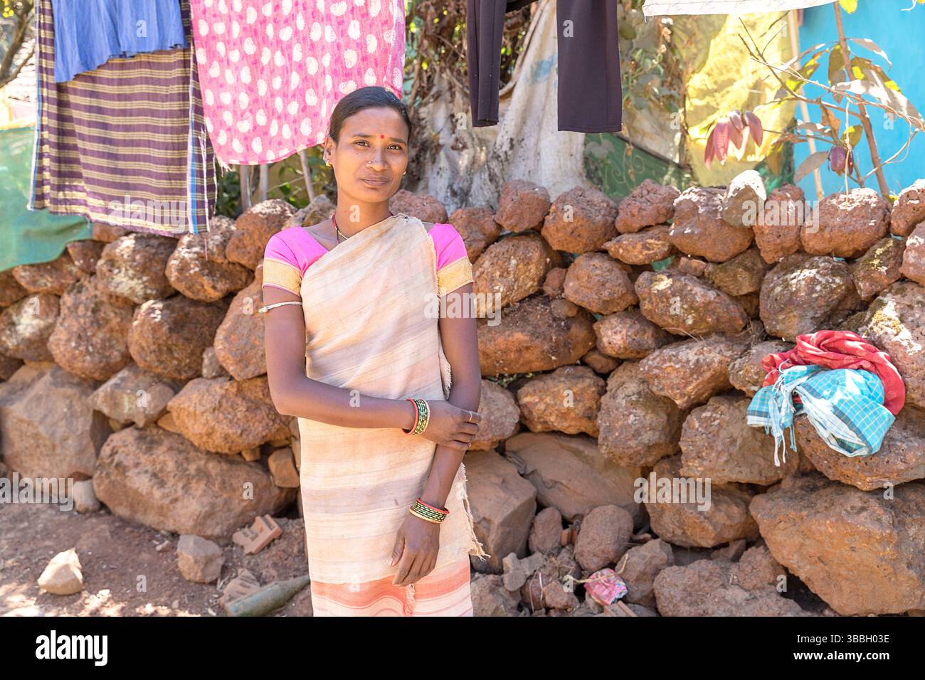 Woman in a small village in rural part of orissa in india dressed in ...