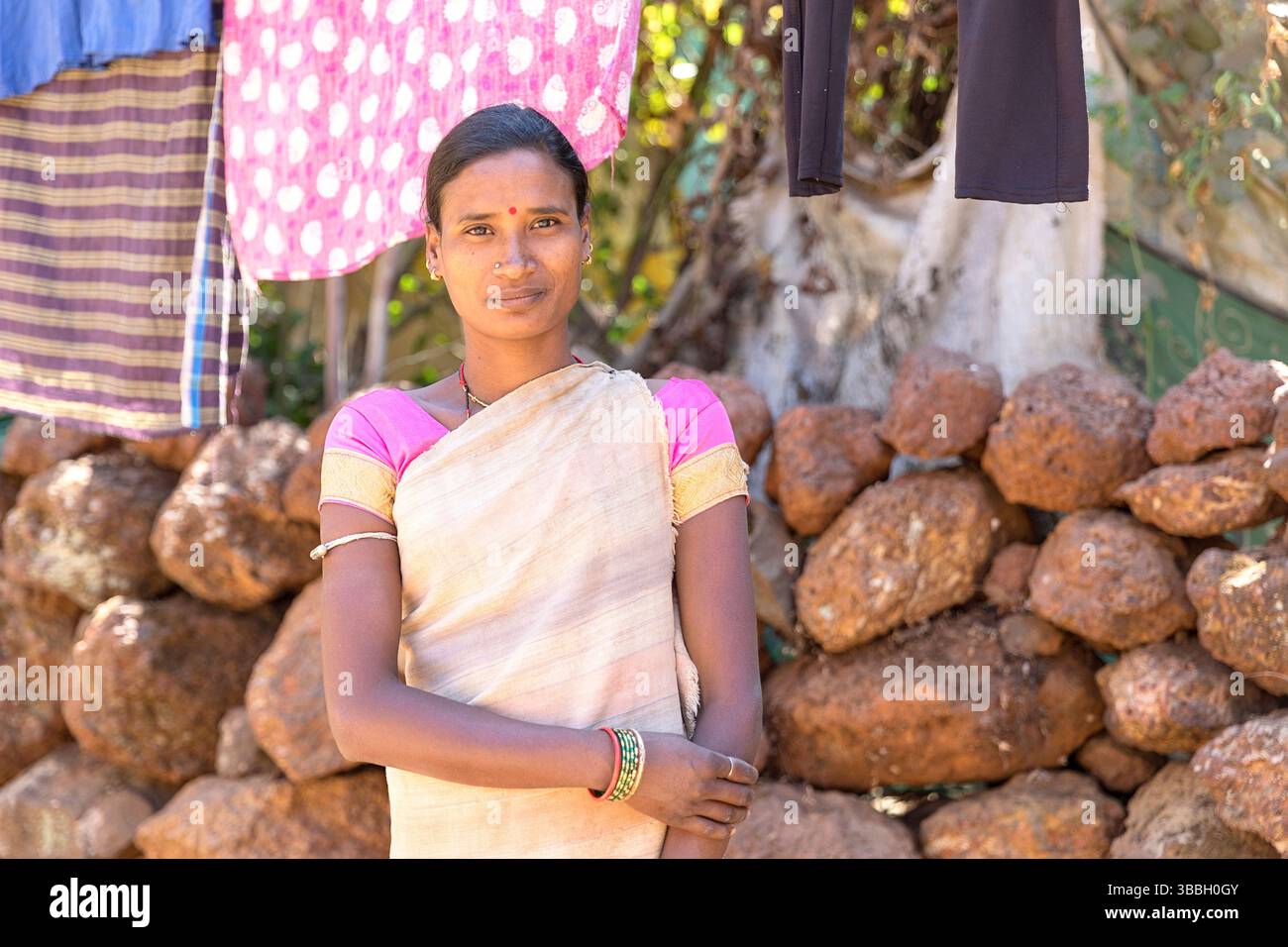 Woman in a small village in rural part of orissa in india dressed in ...