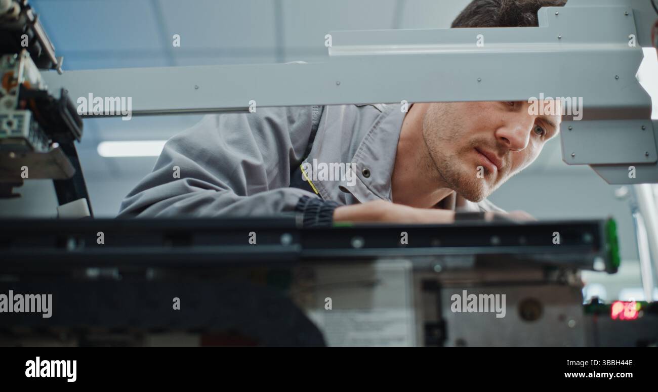 Atm technician in uniform performing hi-res stock photography and ...