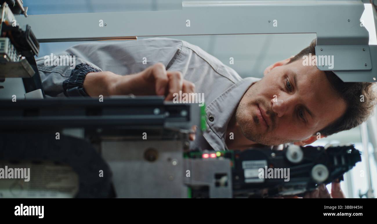 Atm technician in uniform performing hi-res stock photography and ...