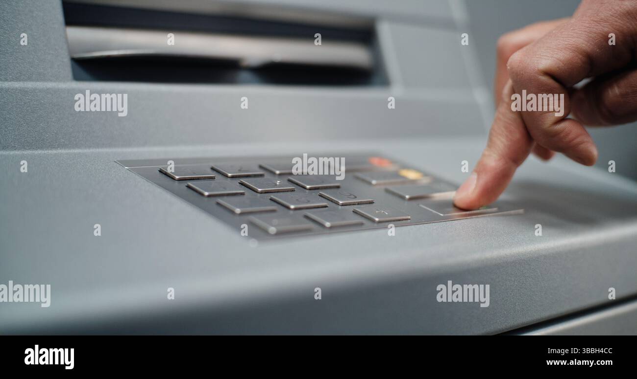 Atm machine unrecognizable man entering hi-res stock photography and images - Alamy