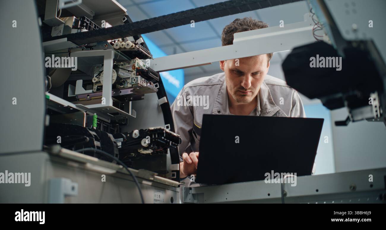 Atm technician in uniform servicing hi-res stock photography and images ...