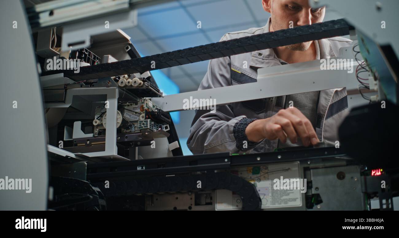 Technician Servicing ATM Machine in Modern Airport Terminal. Male ...