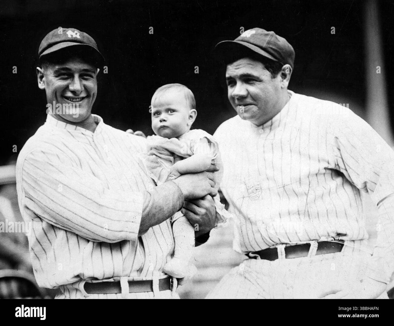 Lou Gehrig Holding a Baby & Babe Ruth standing by, 1927 Stock Photo - Alamy