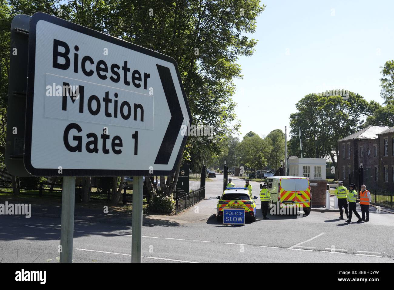 Police officers patrol at a cordon near the scene of a fire at Bicester ...