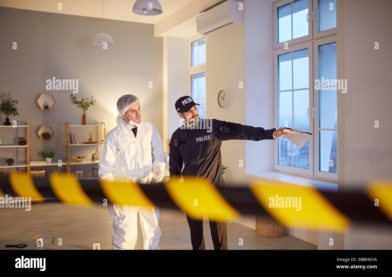 Criminologist police officer investigating hi-res stock photography and ...