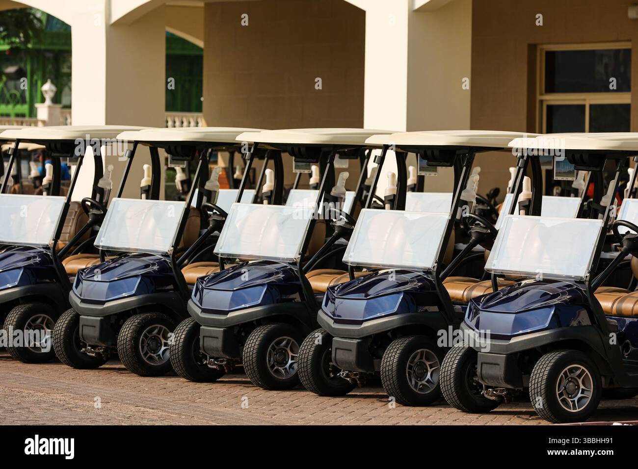 Luxury Golf Resort with Row of Golf Carts Stock Photo - Alamy