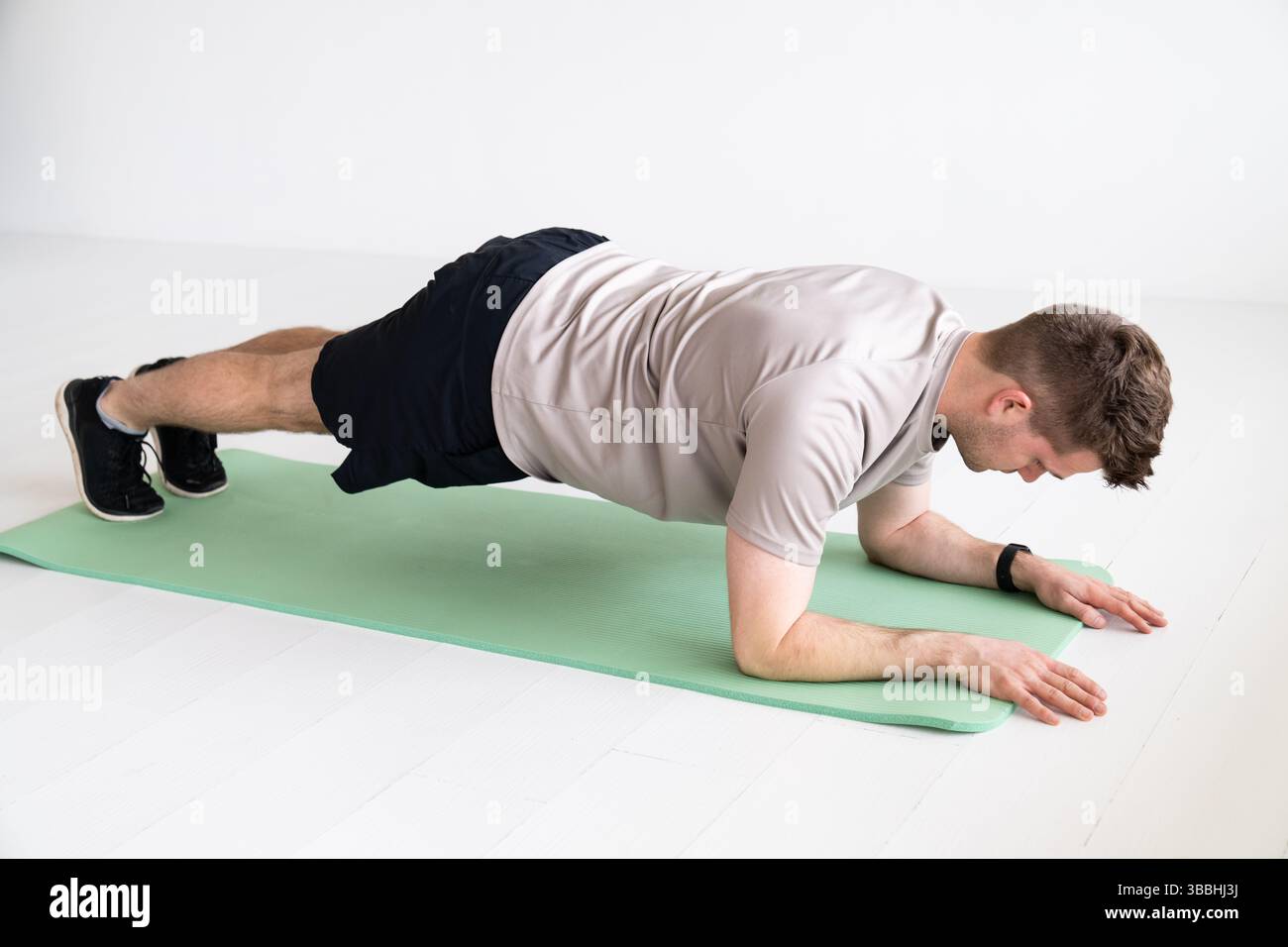 Strong sport man holding hi-res stock photography and images - Alamy