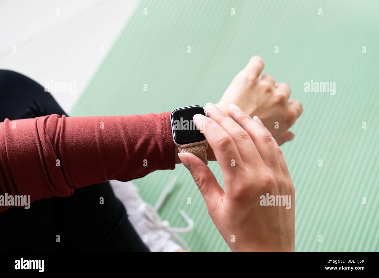 Woman checking fitness health tracking hi-res stock photography and ...