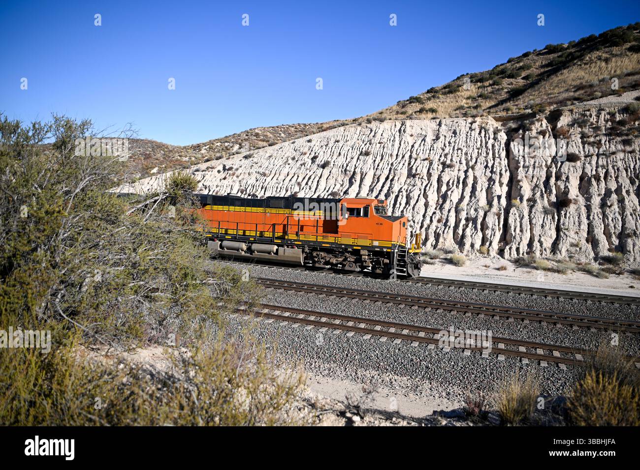 Powerful locomotive engine emerging on railroad tracks Stock Photo - Alamy