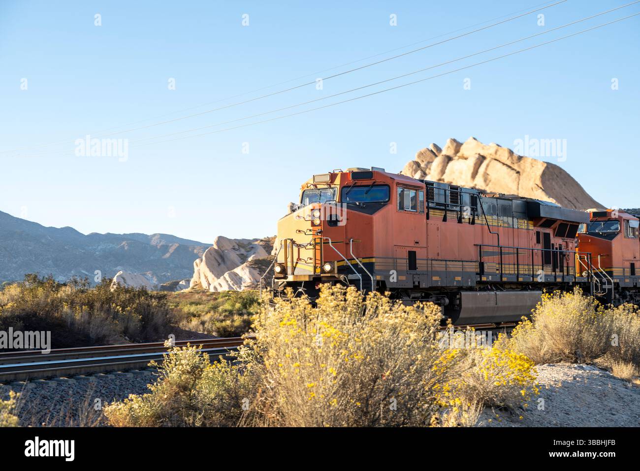 Locomotive engine approaching on tracks through Mormon Rocks Stock ...