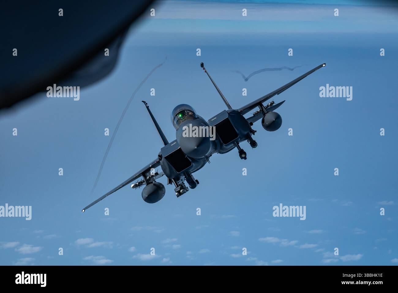A U.S. Air Force F-15E Strike Eagle returns to combat air patrol after being refueled over the ...