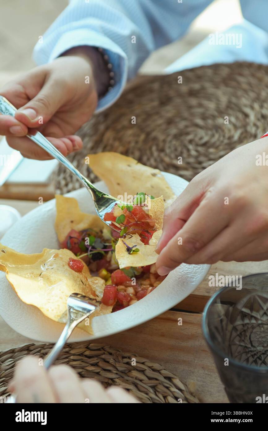 Fresh tuna ceviche starter on a crispy corn tortilla Stock Photo - Alamy