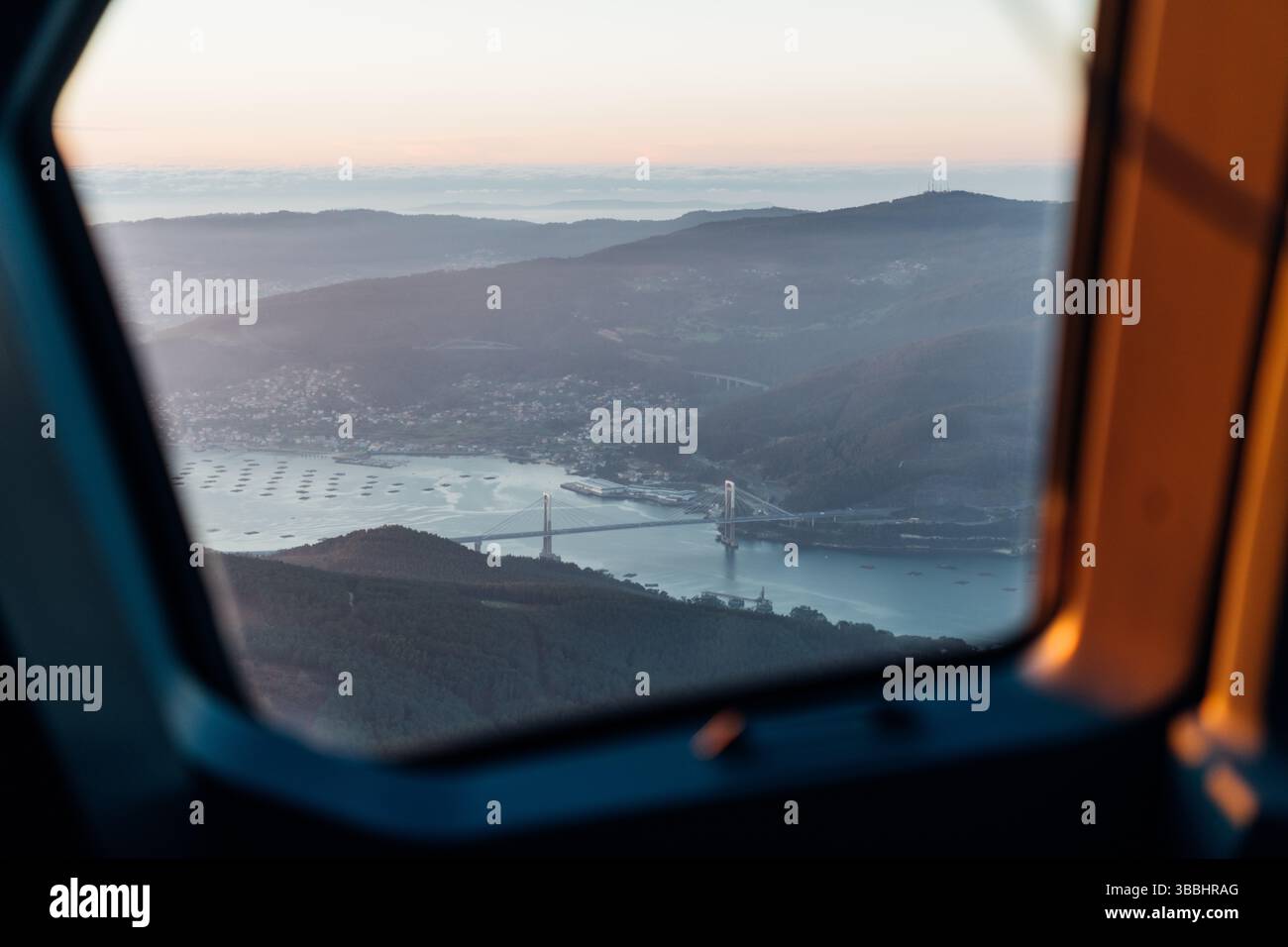 Aerial view of the Vigo estuary and Rande Bridge from airplane window ...