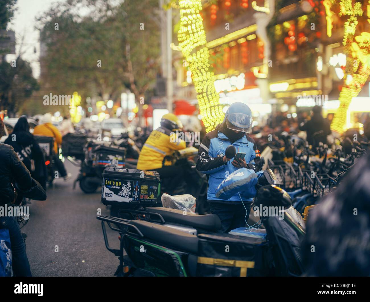 Wuhan Night Street Scene with Eleme and Meituan Delivery Riders Under ...