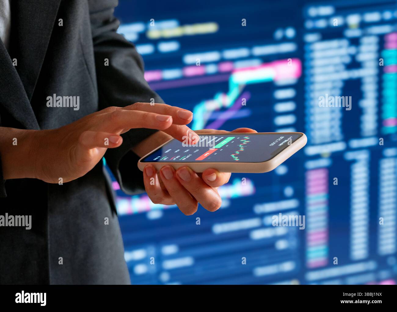 Female investor using smartphone for crypto trading in front of ...
