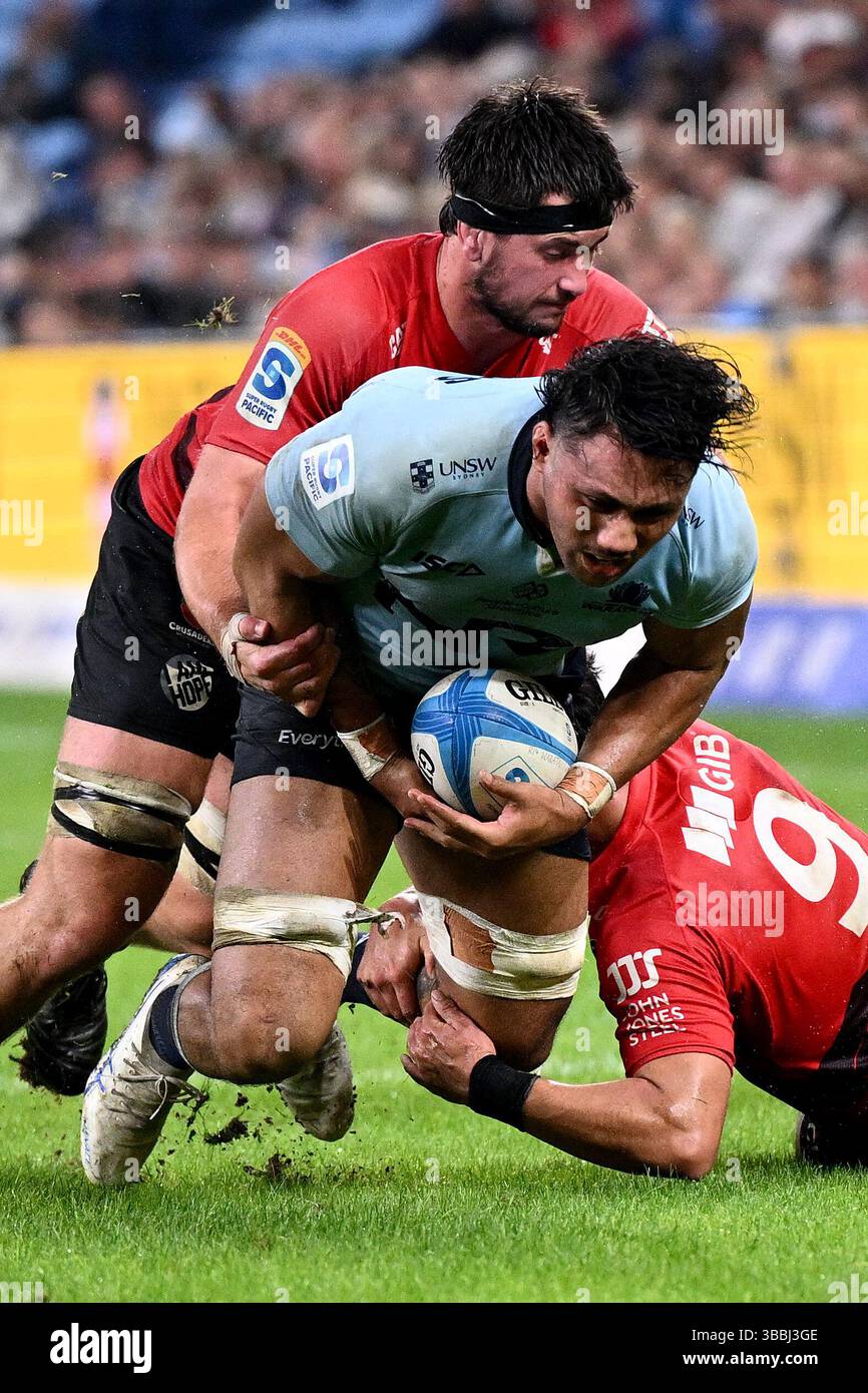 Sydney, Australia. 16th May, 2025. Rob Leota of the Waratahs is tackled ...