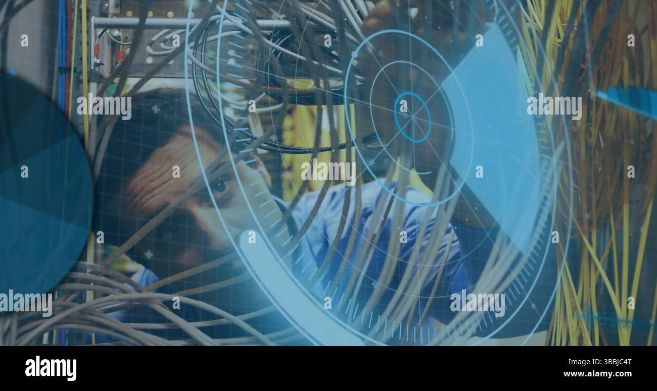 Network technician inspecting colored cable bundles in server rack ...
