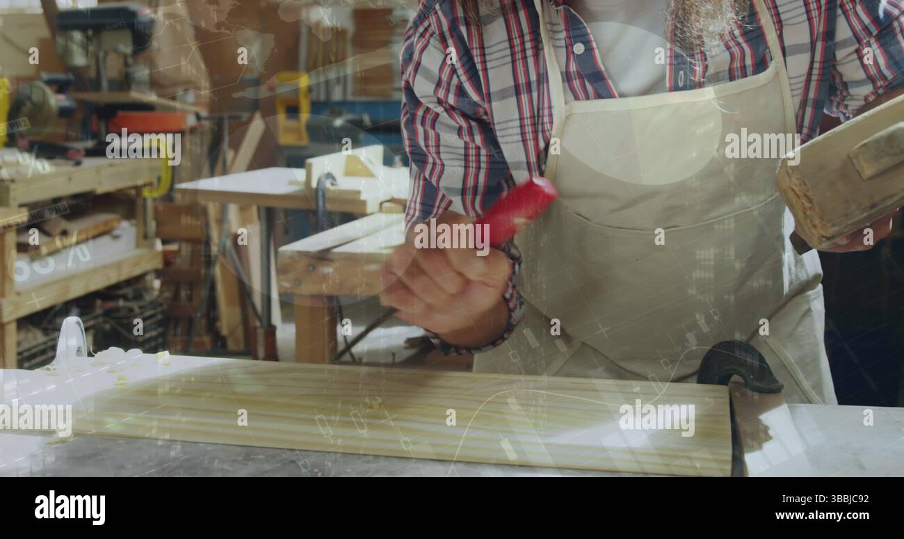 Smoothing mature carpenter shaping slatted wooden panel at workshop ...