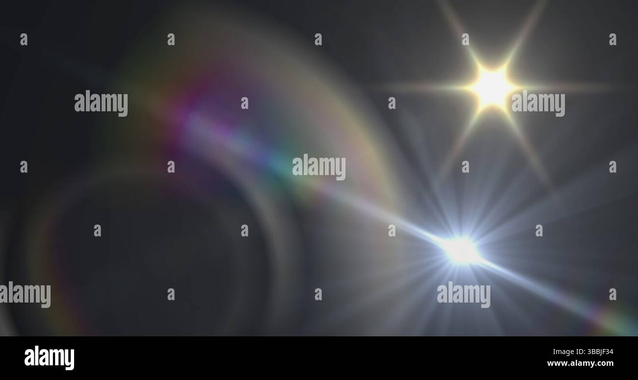 Image of white light with beam and prismatic lens flare on dark ...