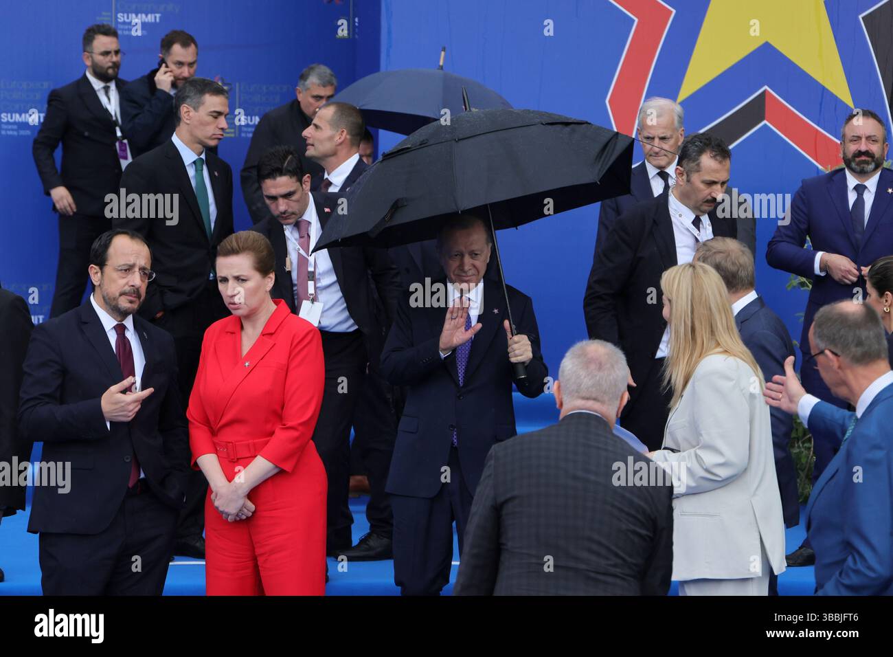 Turkish President Recep Tayyip Erdogan, center, waves before the family ...