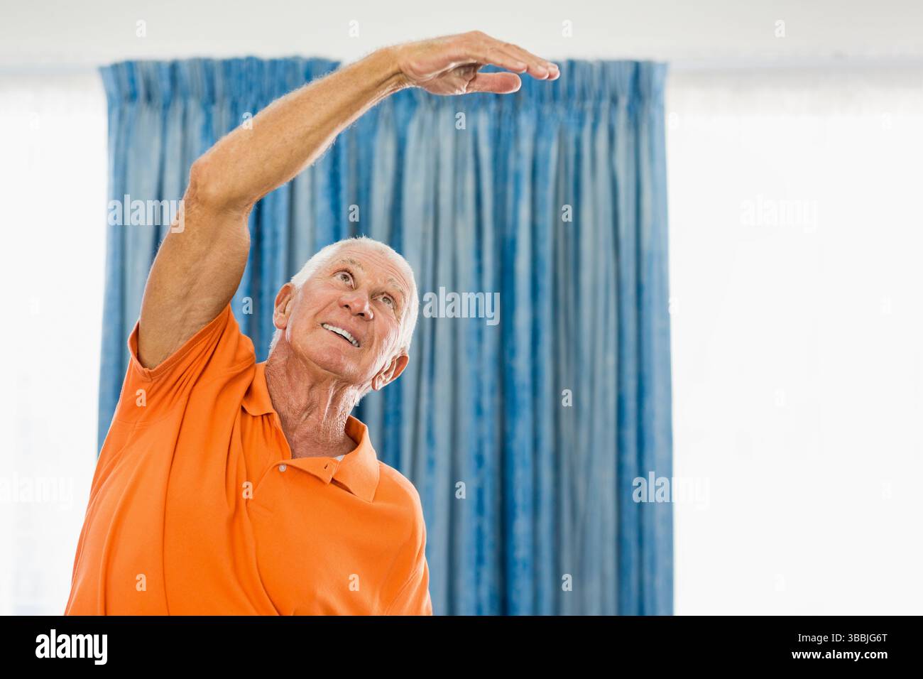 Positive man lifting up shirt hi-res stock photography and images - Alamy
