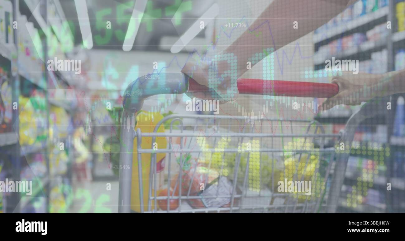 Pushing shopper moving grocery cart with produce down supermarket aisle ...