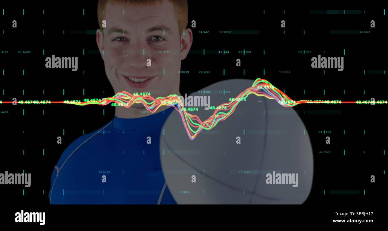 Spinning male athlete wearing blue sports shirt and leggings in studio ...