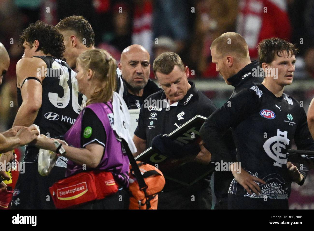 Sydney, Australia. 16th May, 2025. Blues coach Michael Voss (centre ...